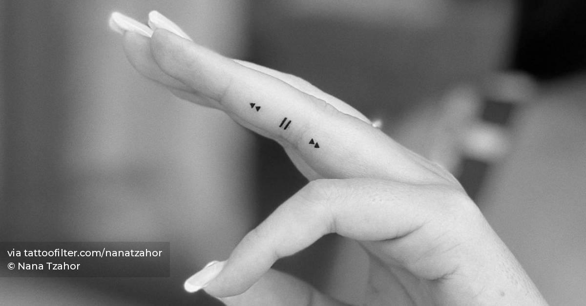 Minimalistic style media controls tattooed on the