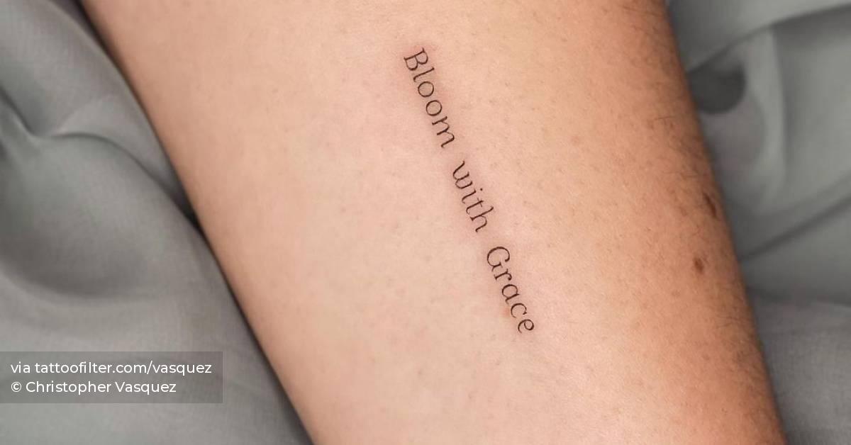 "Bloom with grace" lettering tattoo done on the inner