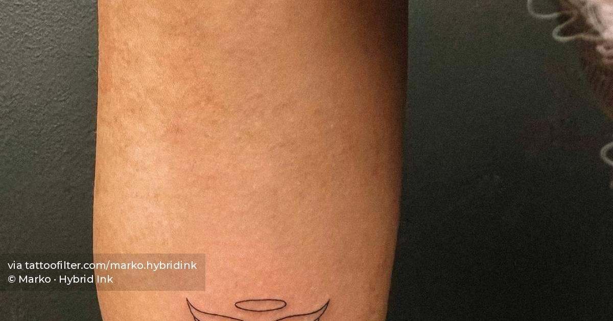 Fine line angel wings and halow tattoo located on the