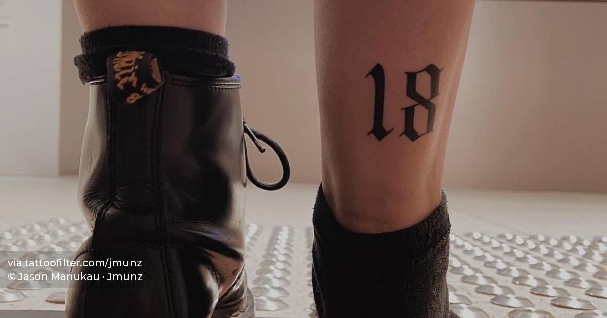 Tattoo of the number "18" located on the achilles.