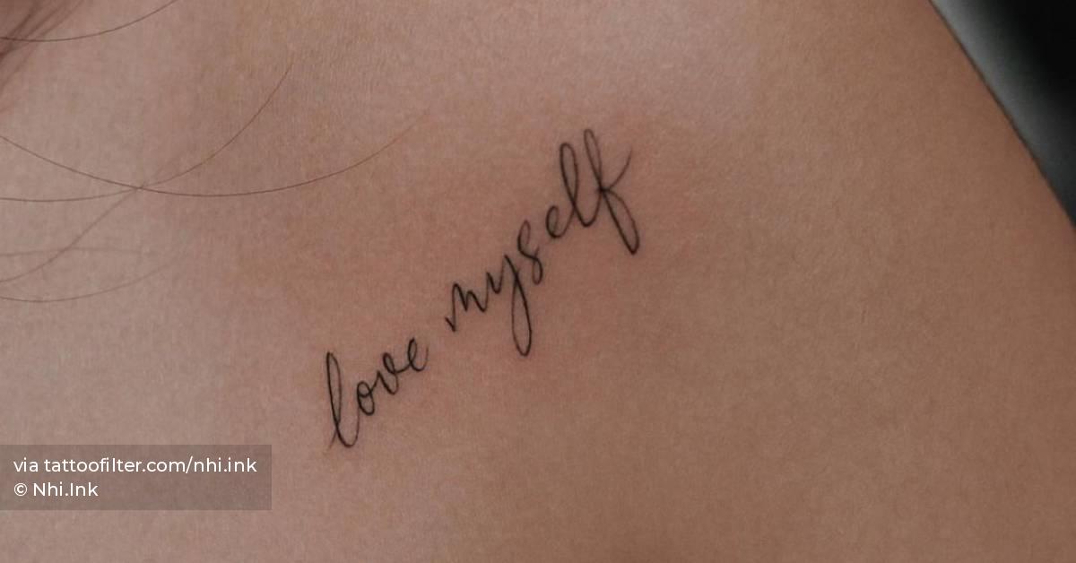 Tattoo that says "love myself" located on the shoulder.