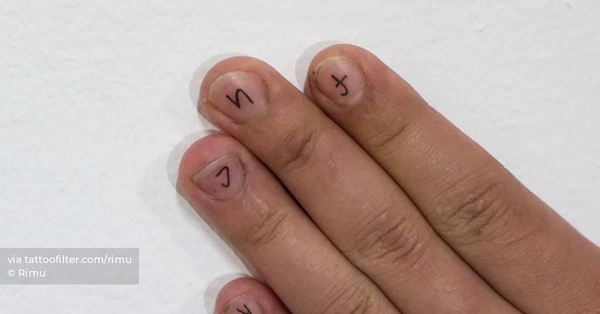Initials tattooed on the nails.
