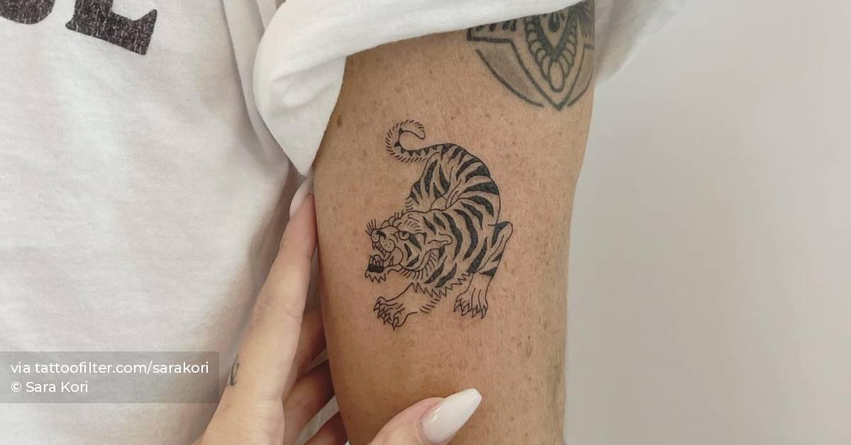 Tiger tattoo located on the upper arm.