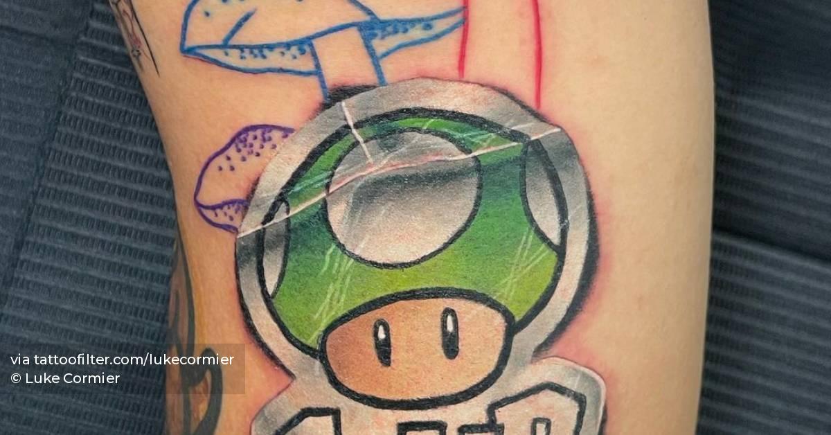 Super Mushroom sticker tattoo located on the tricep.