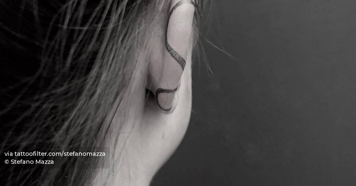 Snake tattoo on the ear.