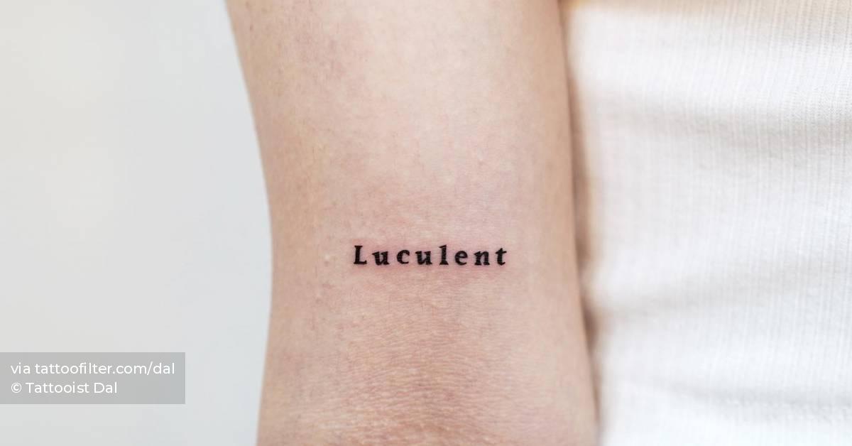 Tattoo of the word "luculent" located on the bicep.