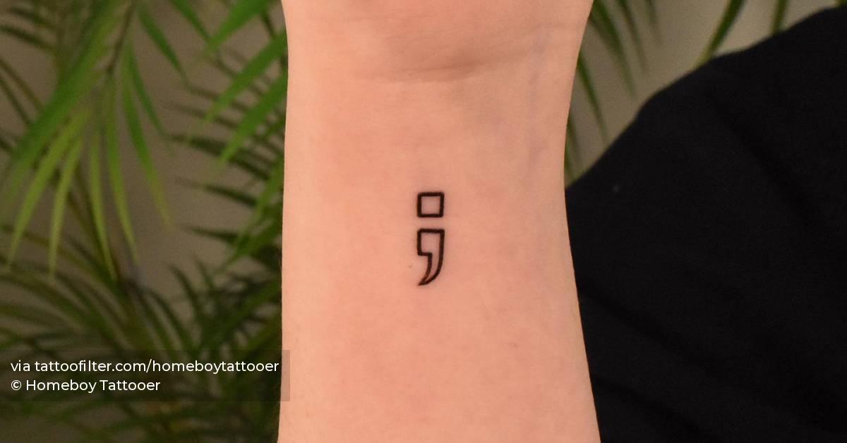 Minimalistic style semicolon tattoo done on the wrist.