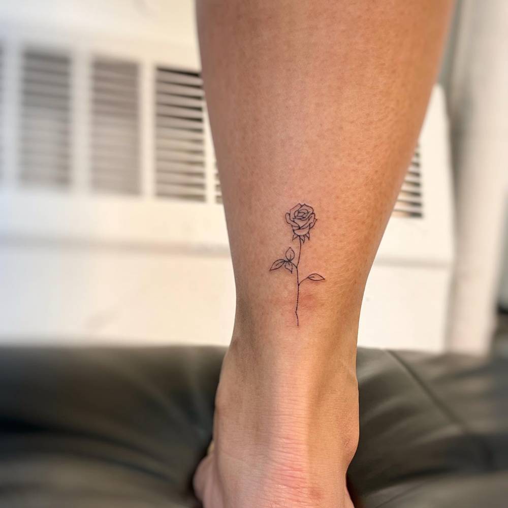 Dainty Single Rose Tattoo Located On The Achilles Dainty Single Rose Tattoo Located On The Achilles