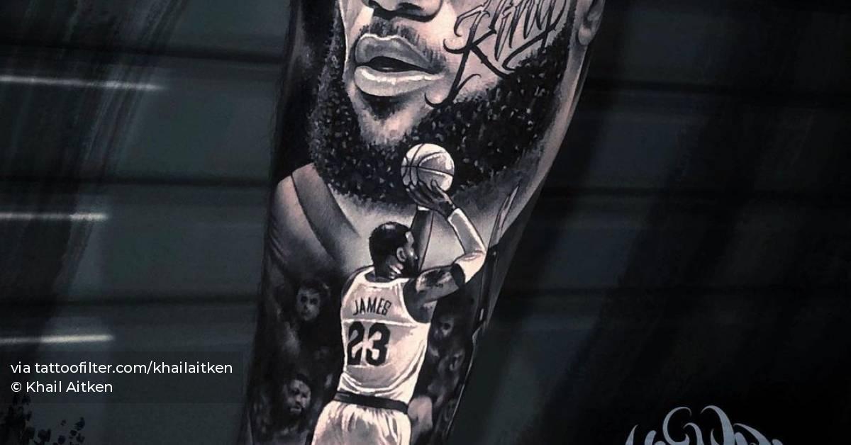 Black and grey Lebron James tattoo located on the shin.