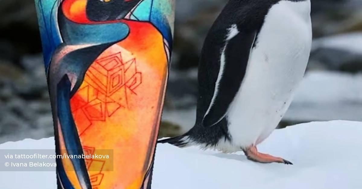 Watercolor style penguin tattoo located on the inner