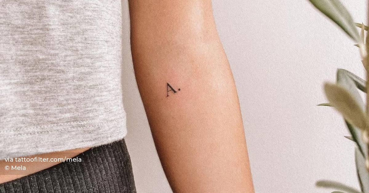 A letter tattoo on the inner forearm.