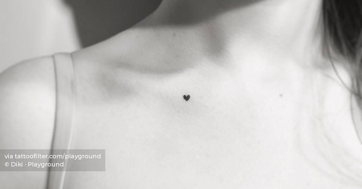 Tiny heart tattoo done on the collarbone, minimalistic