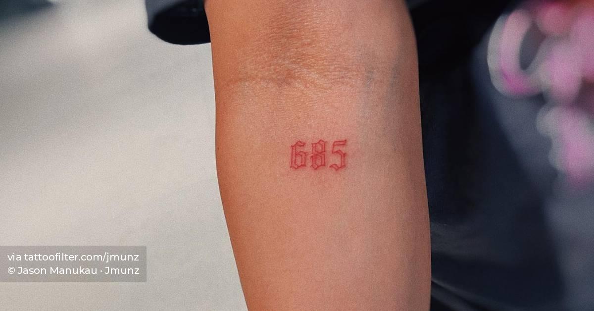 "685" lettering tattoo located on the inner forearm.