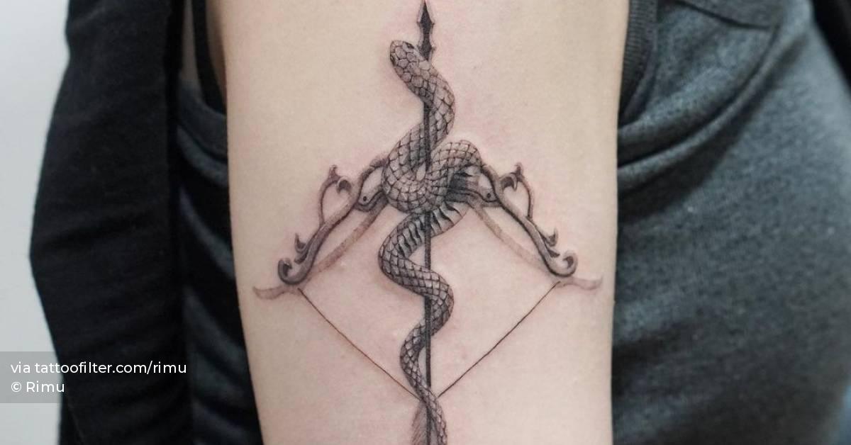Micro-realistic bow, arrow and snake tattoo located on