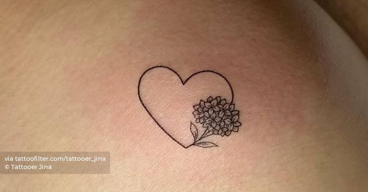 Fine line heart and flower tattoo on the shoulder.