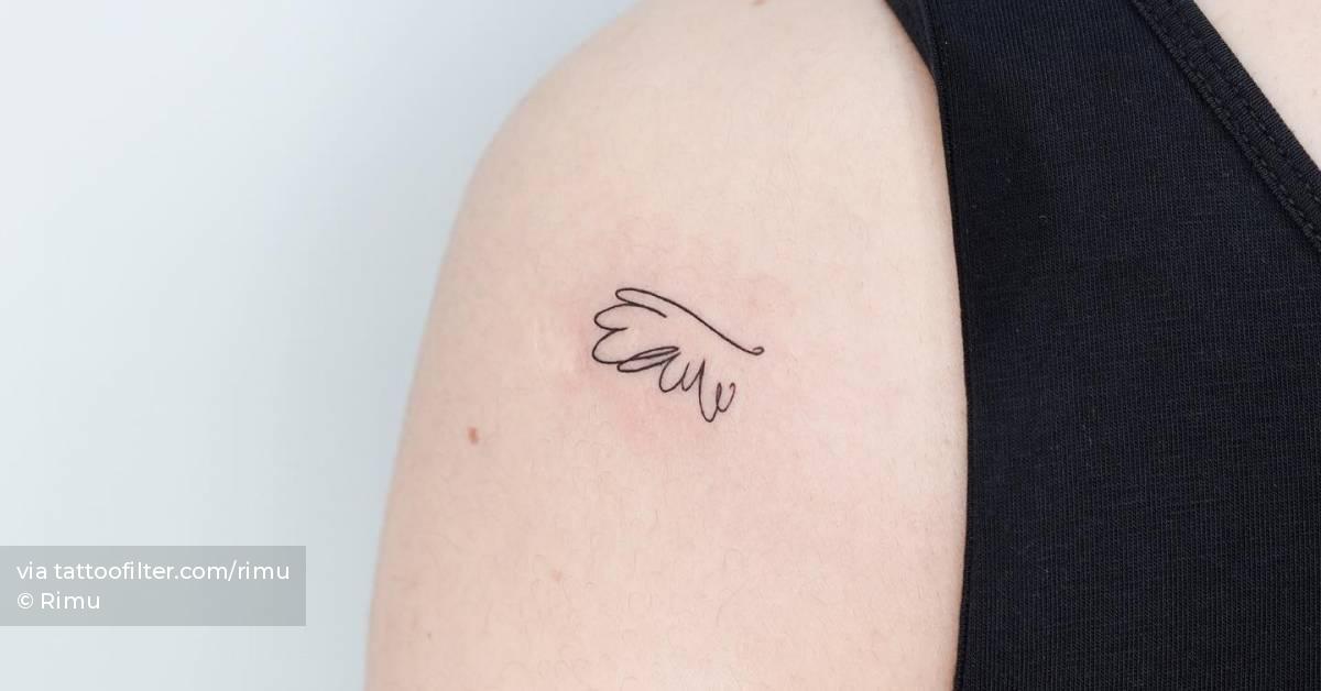 Abstract wing tattoo located on the shoulder.