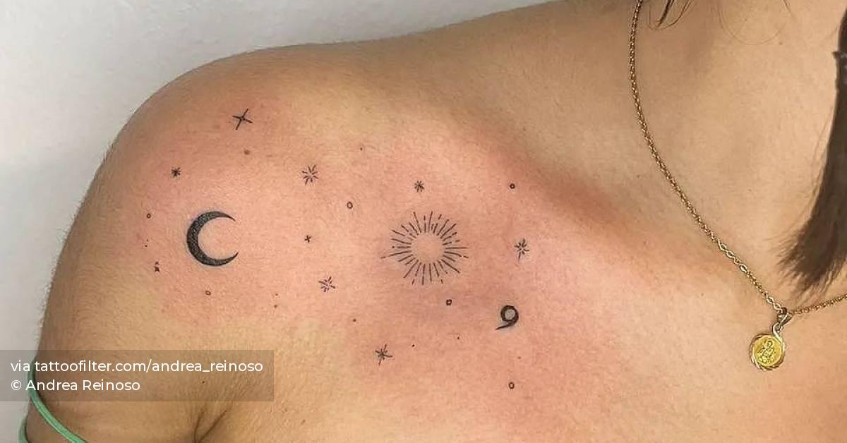 Starry sun and moon tattoo located on the shoulder,