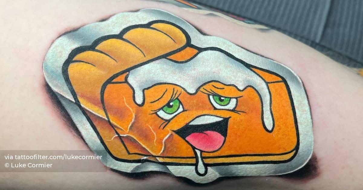 Pie sticker tattoo located on the inner arm.