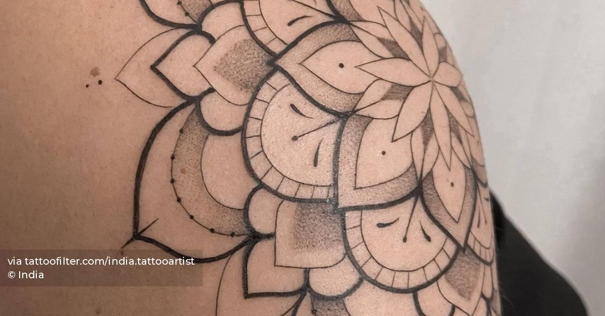 Mandala tattoo on the shoulder.