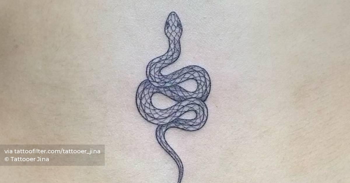 Fine line snake tattoo on the lower back.
