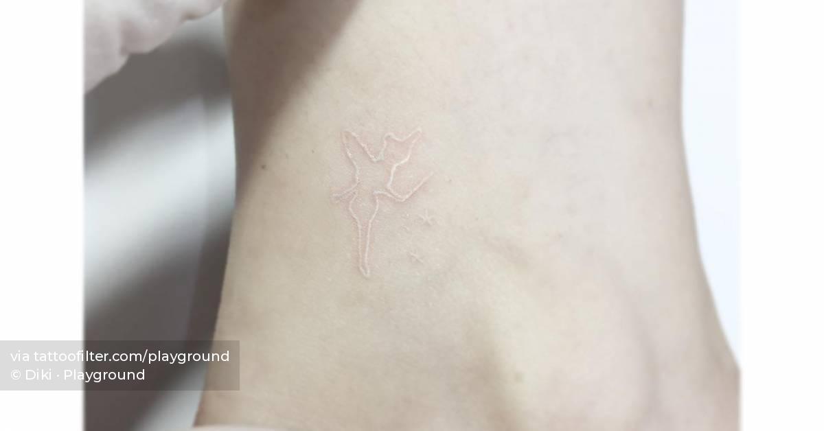 Tiny minimalistic white ink Tinker Bell tattoo located
