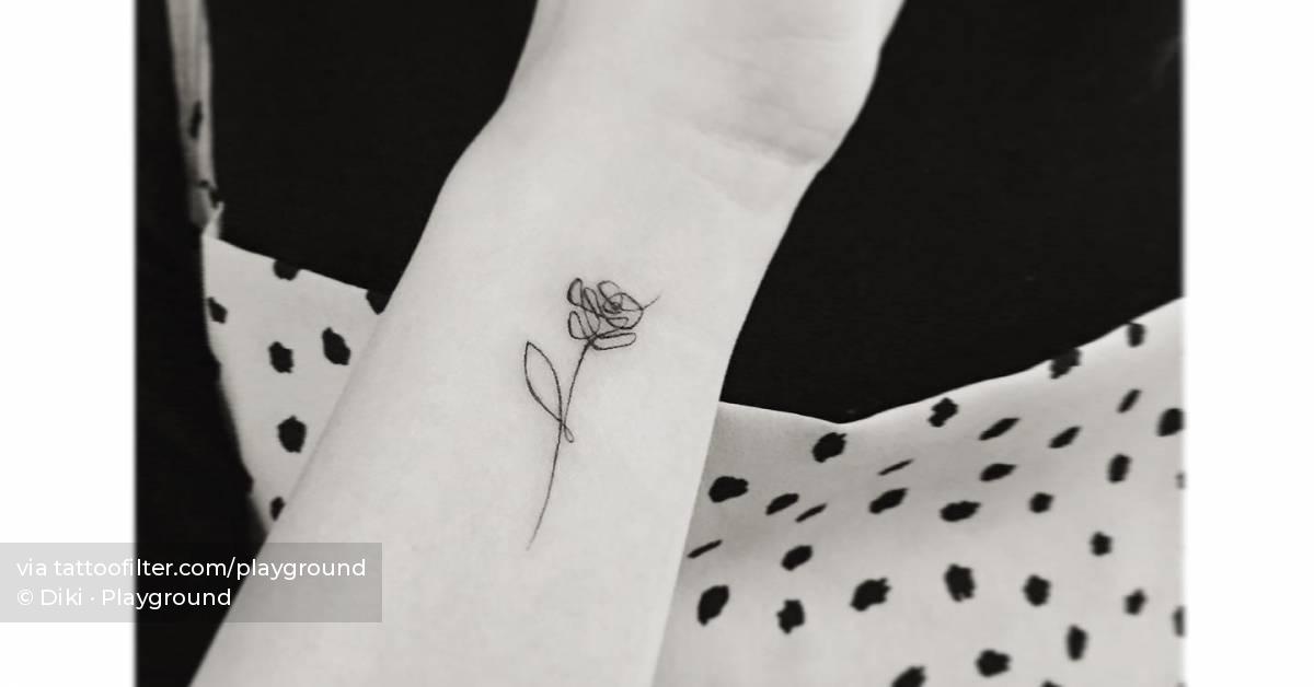 One line rose tattoo located on the wrist.