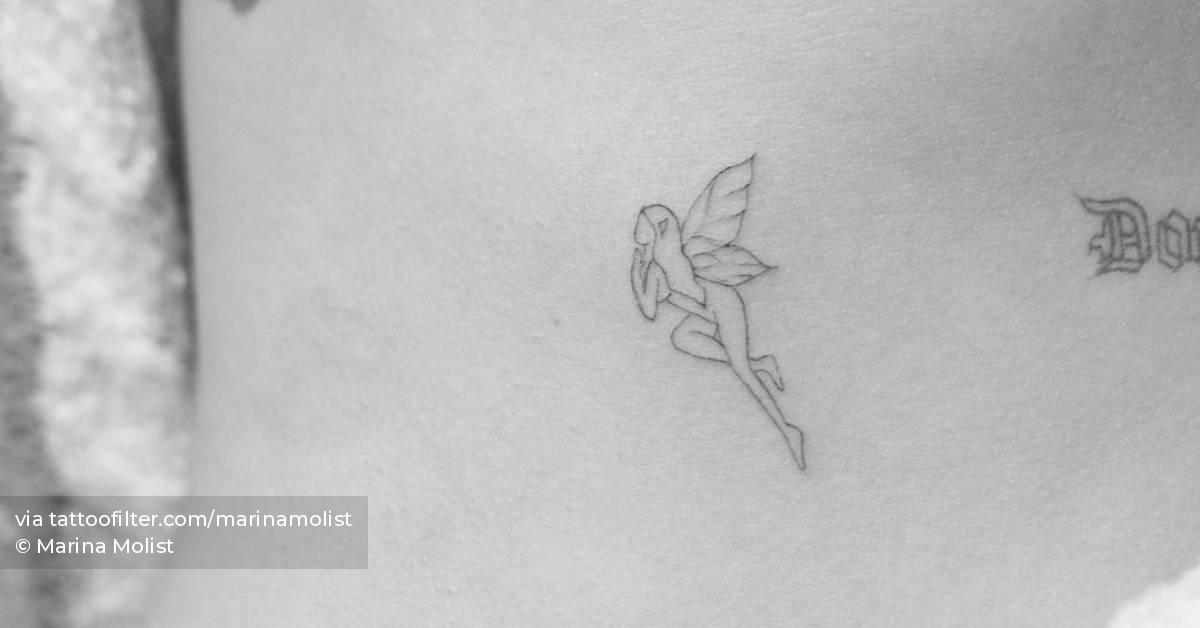 Fine line fairy tattoo located on the rib.