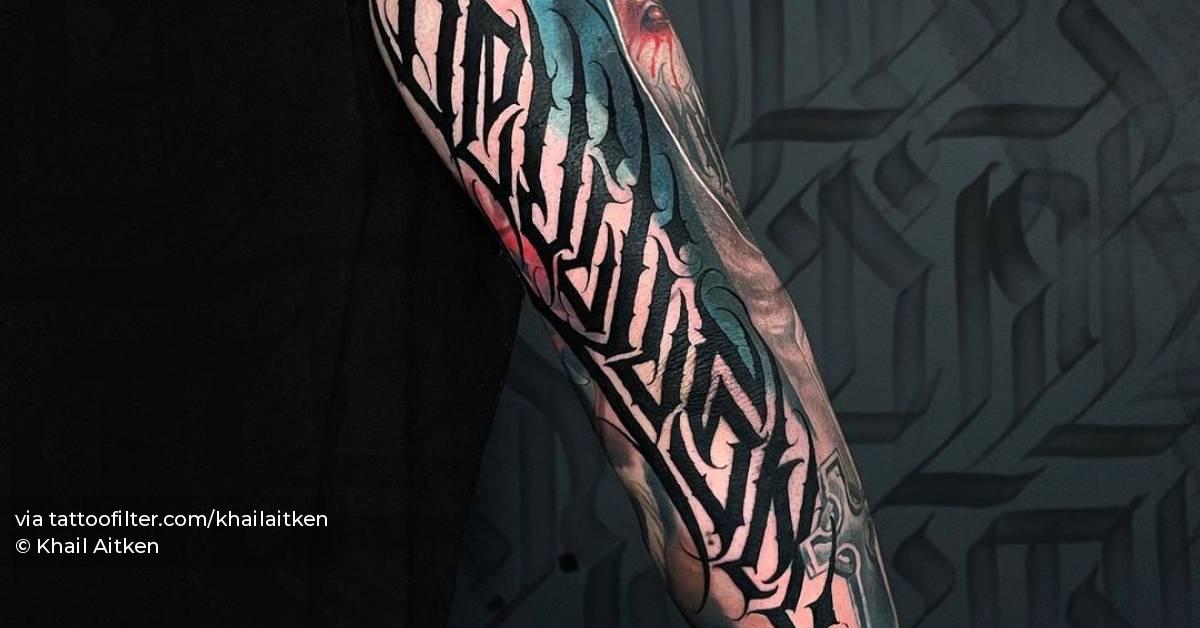 Huge "devilish" lettering tattoo located on the arm