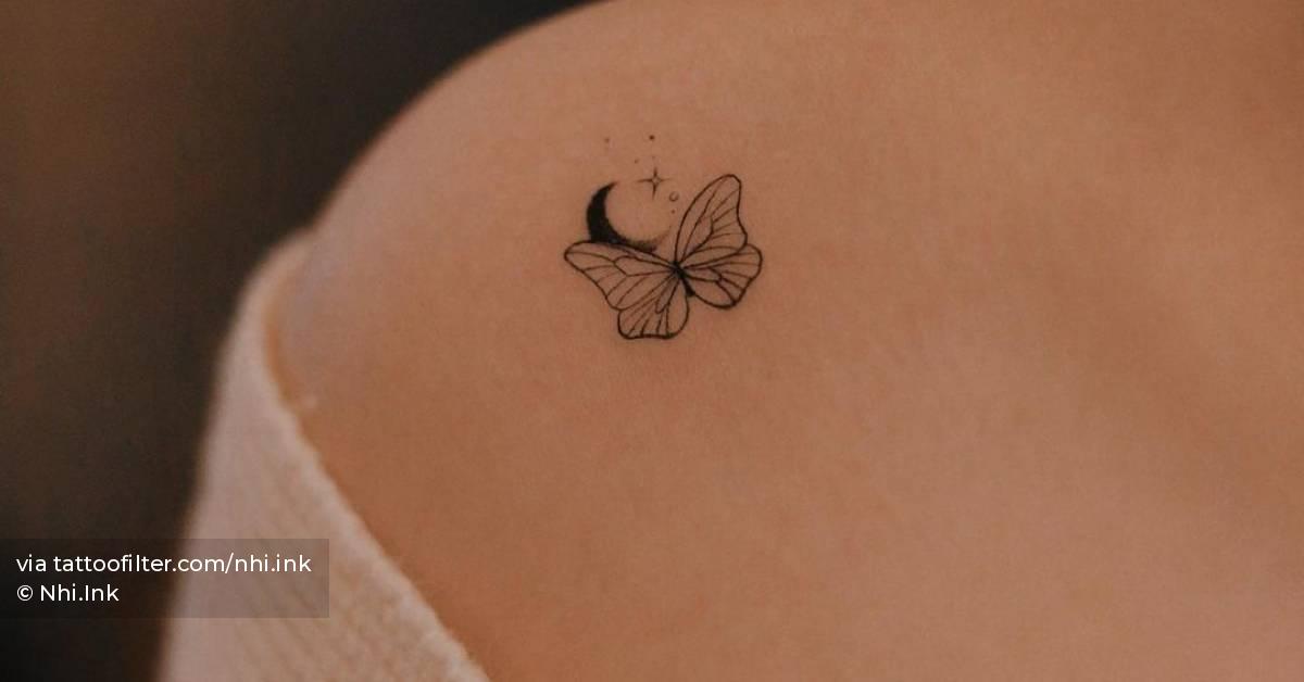 Butterfly and moon tattoo located on the shoulder.
