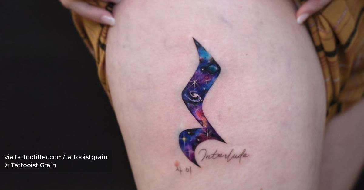 Space quarter rest tattoo located on the thigh.