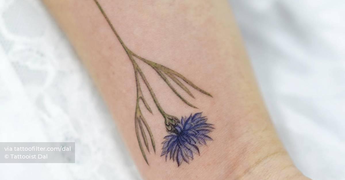 Cornflower tattoo located on the wrist.