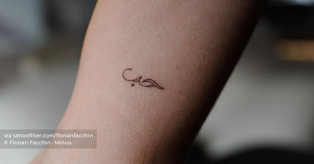 Arabic lettering tattoo located on Astrid-Olivia's
