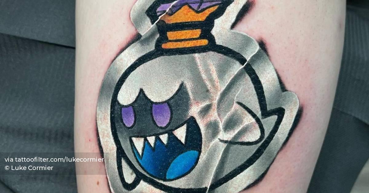 King Boo sticker tattoo located on the upper arm.