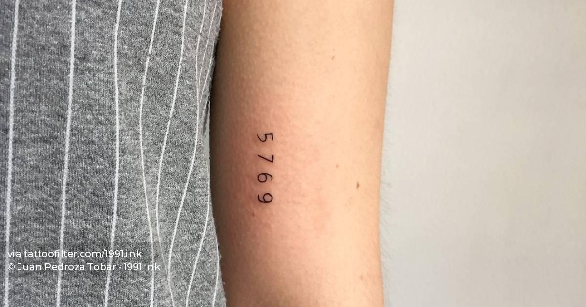 Numbers tattoo on the bicep