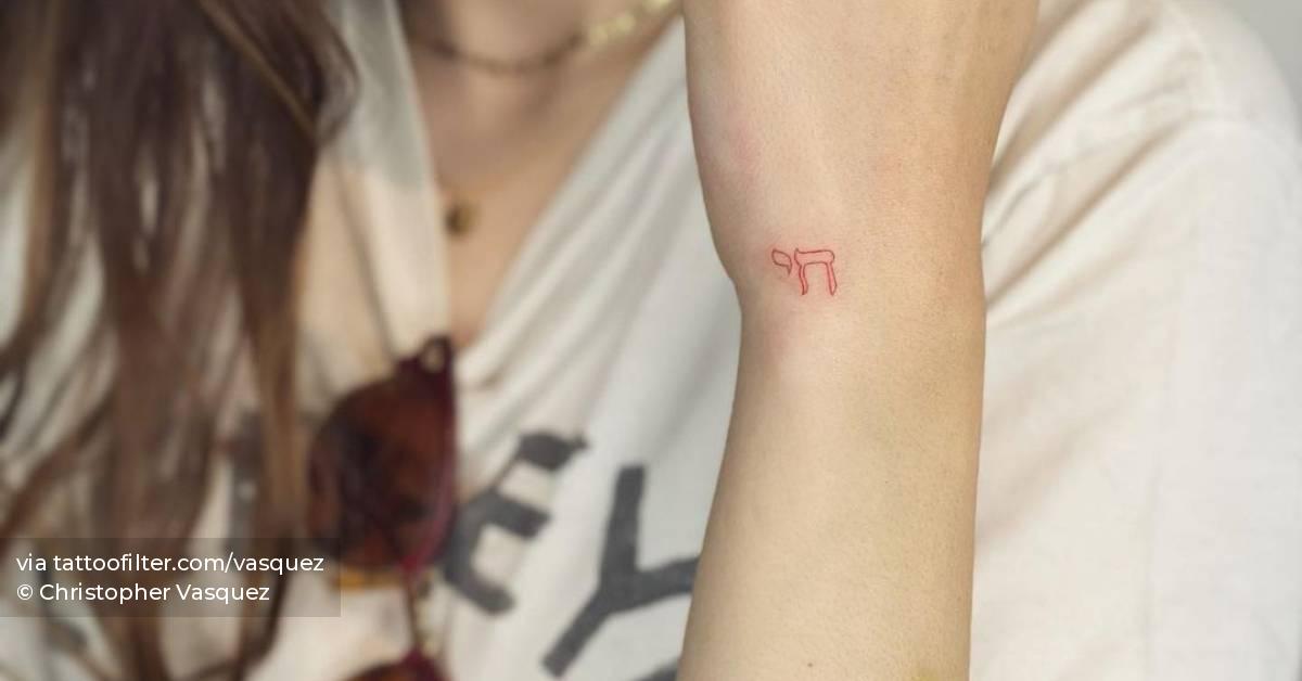 Number 18 in hebrew tattooed on Anjelica Fellini's