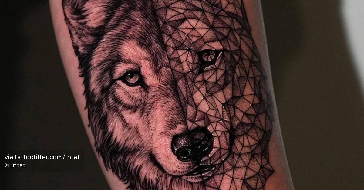 Wolf head tattoo located on the inner forearm.