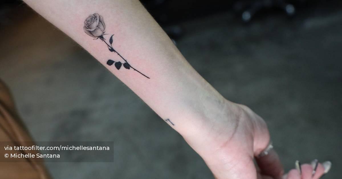 Micro-realistic rose tattoo located on the inner