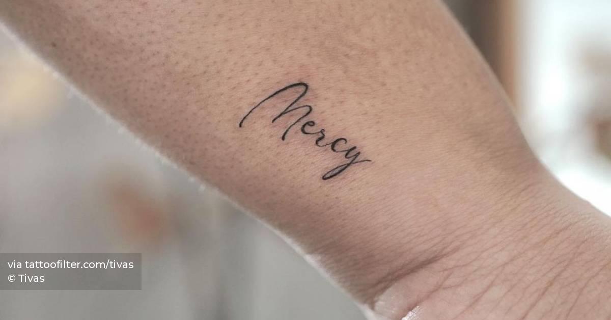 Tattoo of the word "mercy" located on the wrist.