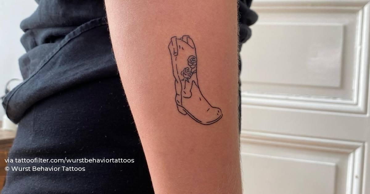 Ignorant style cowboy boot tattoo located on the inner