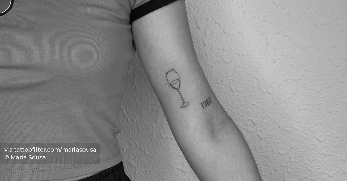 Fine line wine glass and "1967" tattoos.