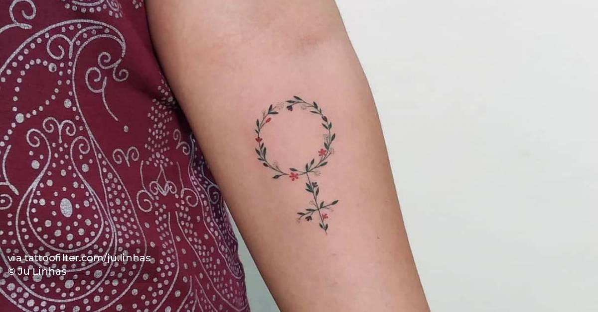 Floral venus symbol tattoo done on the inner forearm.