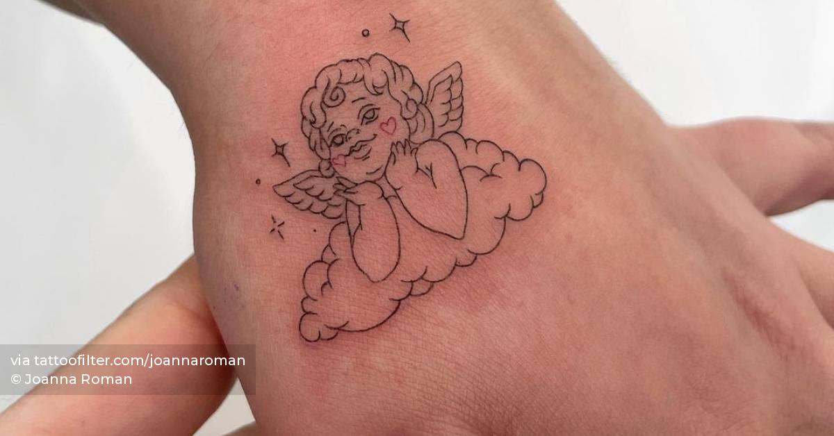 Fine line cherub tattoo placed on the hand.