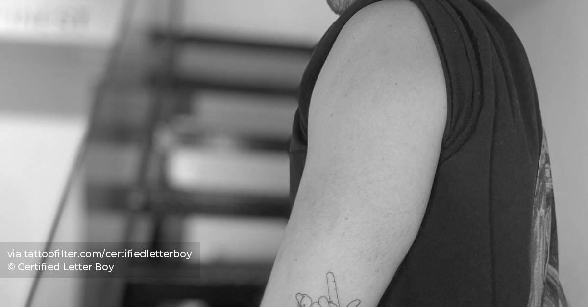 ILY sign tattoo located on Andrew Le Page's tricep.