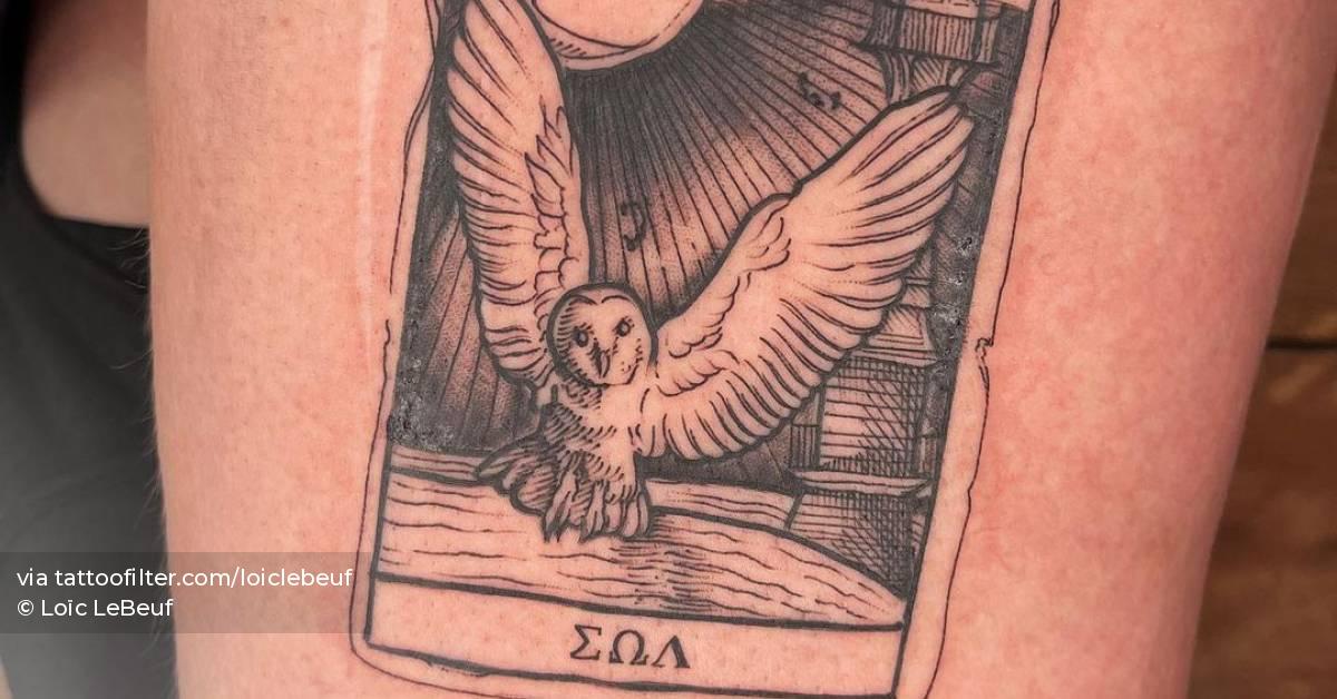 Blackwork style owl tarot card tattoo located on the