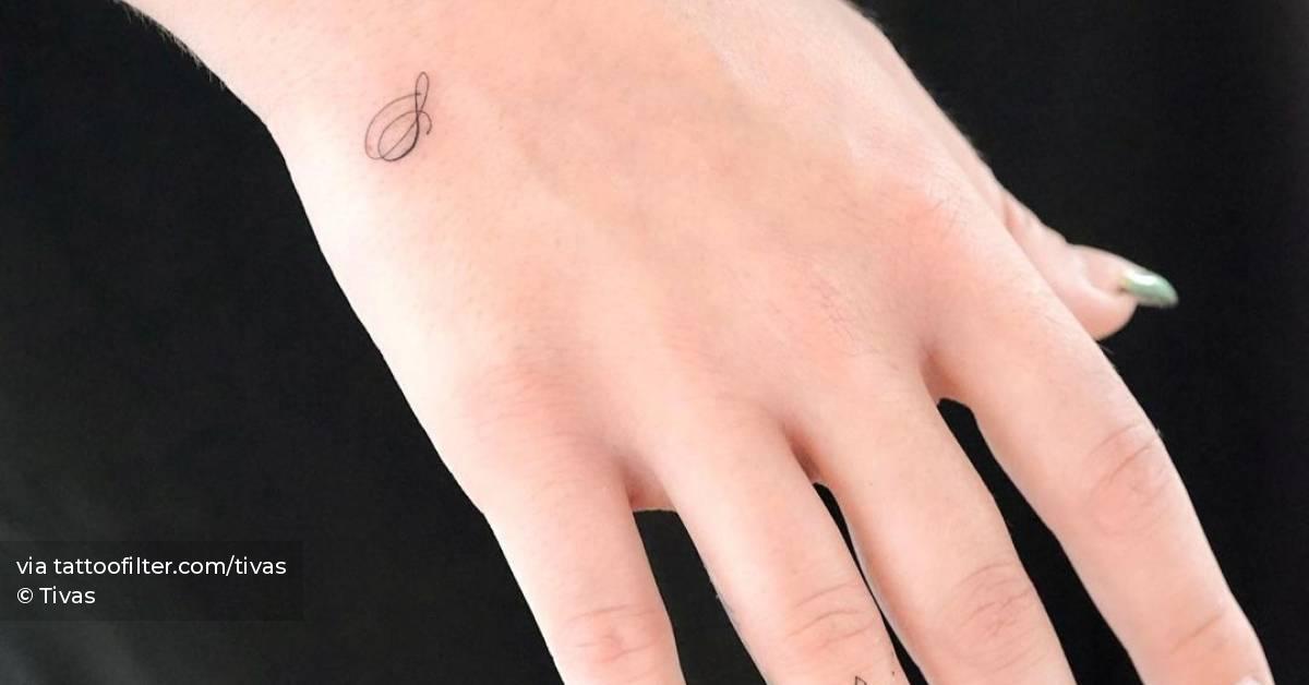 Minimalistic letter "J" and finger ornament tattoo.