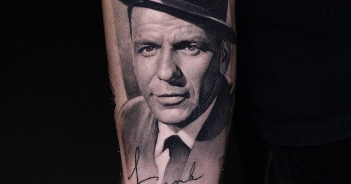 Black and grey Frank Sinatra portrait tattoo located on