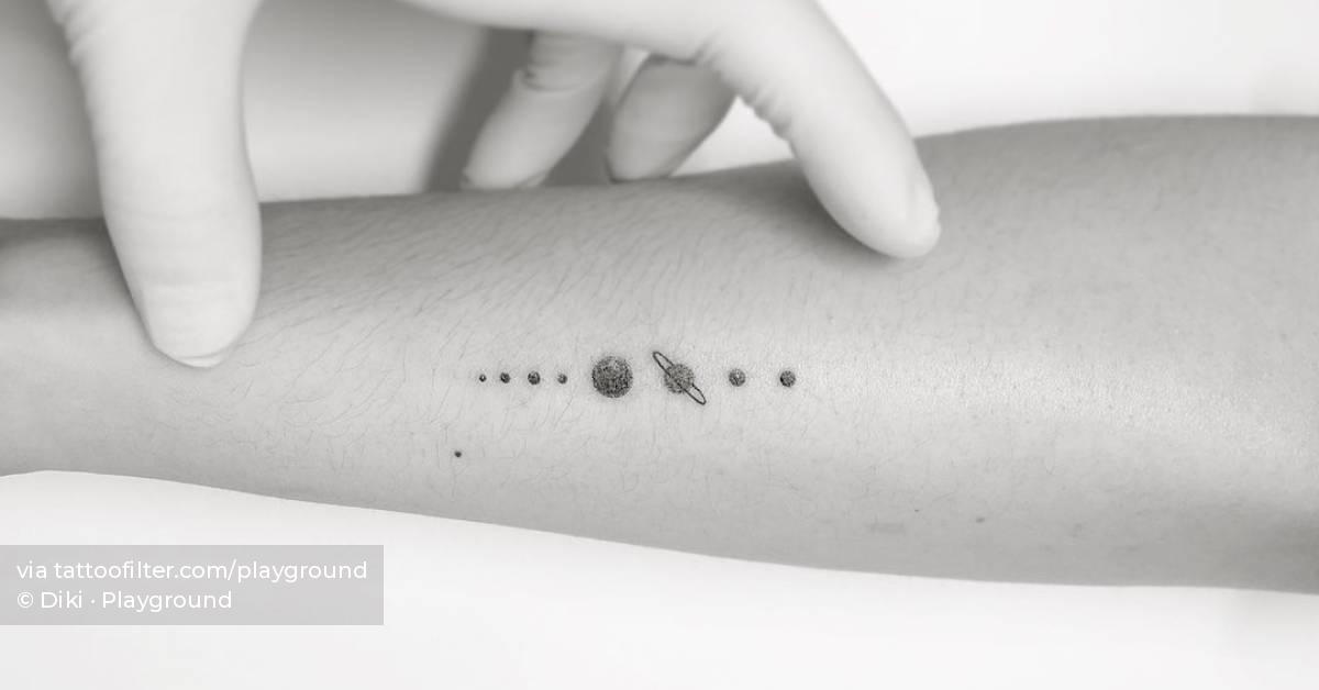 Minimalistic style solar system tattoo done on the