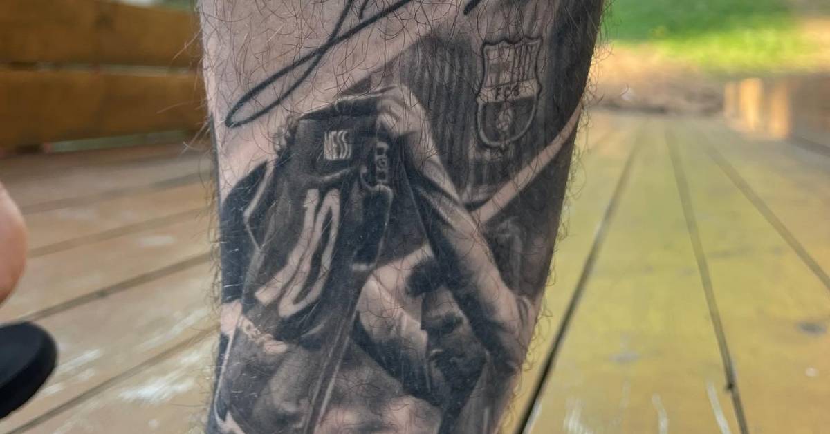 Lionel Messi tattoo located on the shin, black and grey