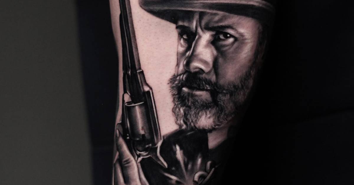 Django's Dr. King Schultz portrait tattoo located on