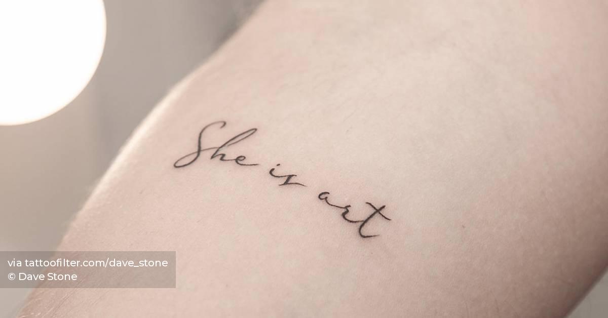 She is art" lettering tattoo located on the inner